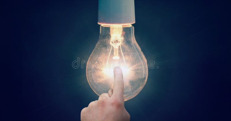 Composition of Finger Touching Lit Light Bulb on Blue Background Stock ...