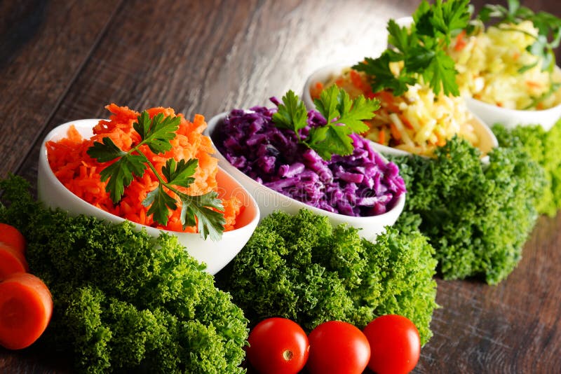 Composition with Four Vegetable Salad Bowls on Wooden Table Stock Image ...