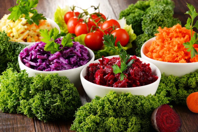 Composition with Four Vegetable Salad Bowls on Wooden Table Stock Photo ...