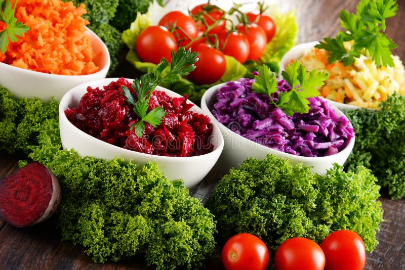 Composition with Four Vegetable Salad Bowls on Wooden Table Stock Photo ...