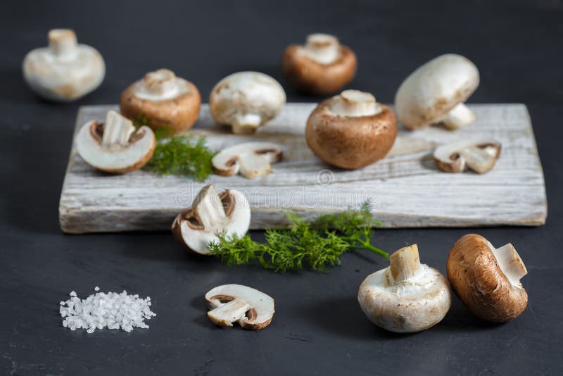 Composition with Fresh Champignon Mushrooms on Wooden Board. Rustic ...