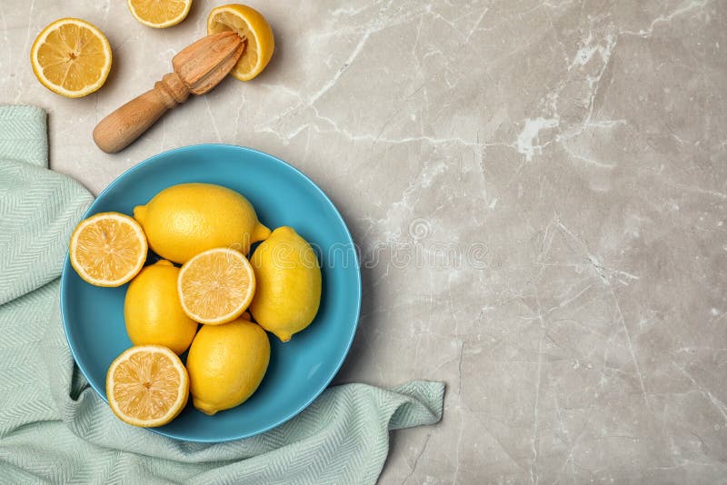 Composition with Fresh Lemons and Wooden Reamer on Table, Top View ...
