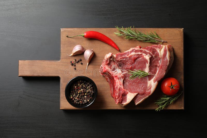 Composition with Fresh Meat on Black Table Stock Photo - Image of ...