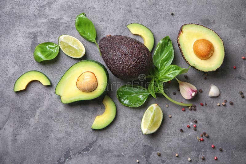 Composition with Fresh Ripe Avocados on Grey Textured Background Stock ...