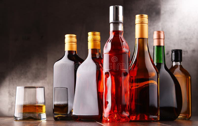Glass and Bottles of Assorted Alcoholic Beverages. Stock Photo - Image ...