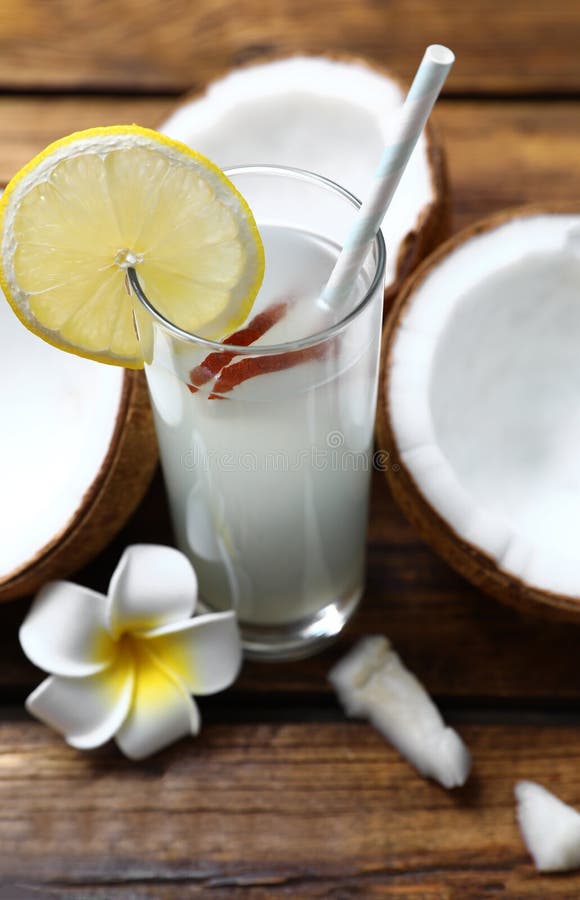 Composition with Glass of Coconut Water and Lemon on Wooden Table Stock ...