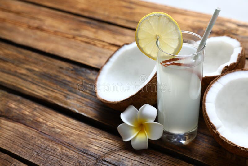 Composition with Glass of Coconut Water and Lemon on Wooden Table Stock ...