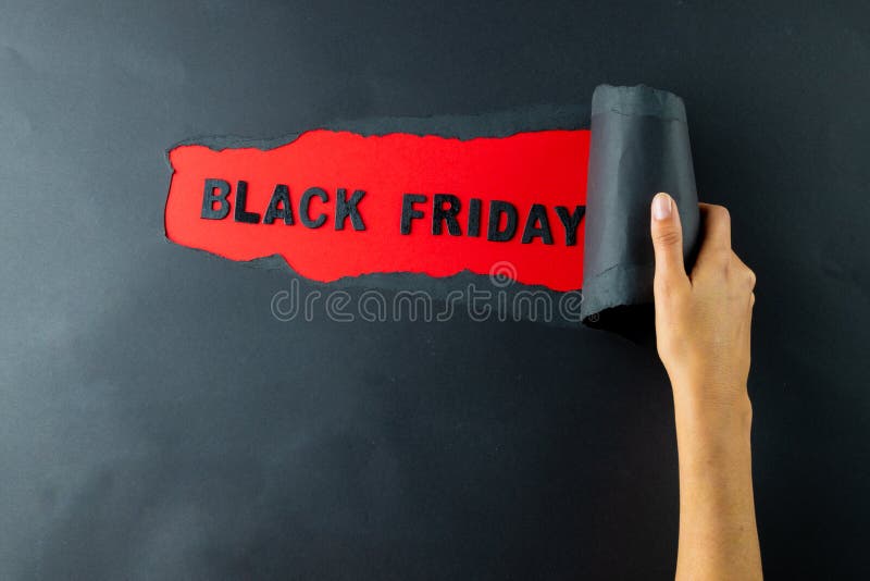 Composition of Hand with Black Paper and Black Friday Text on Red ...