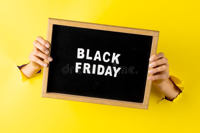 Composition of Hands with Black Friday Text on Yellow Background Stock ...