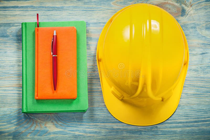 Composition of Hard Hat Notepads Pen on Wooden Board Constructio Stock ...