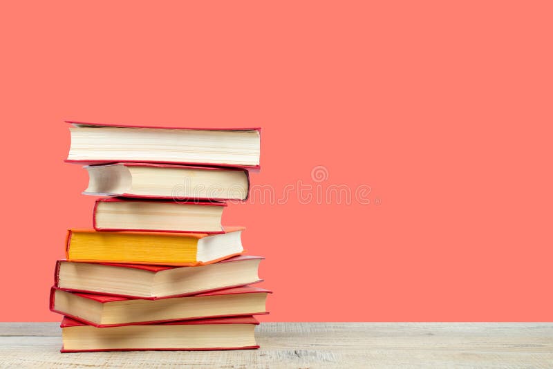 Composition with Hardback Books on Wooden Deck Table and Orange ...