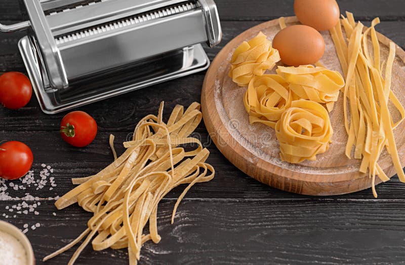 Composition with Homemade Noodles and Pasta Machine on Table Stock ...