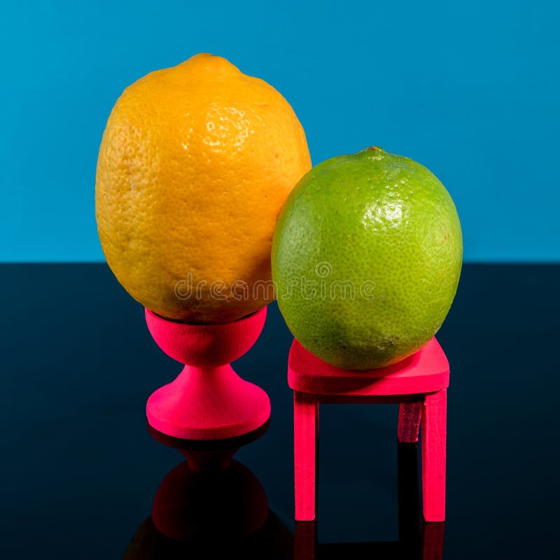 Composition with Lemon and Lime on a Blue Background Stock Photo ...