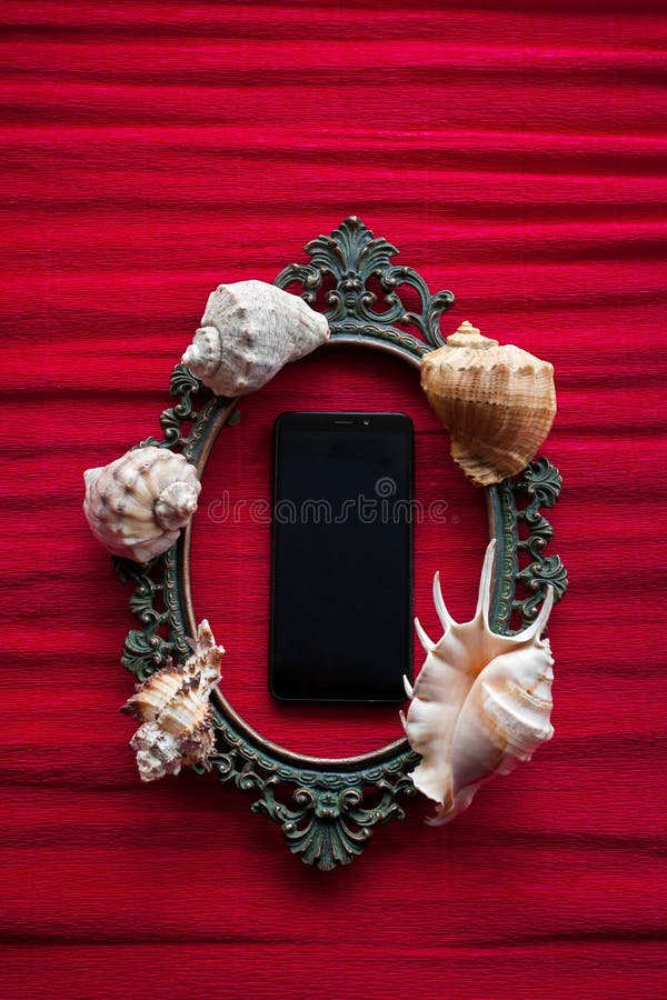 Composition with a Mobile Phone in a Baroque Metal Vintage Frame ...