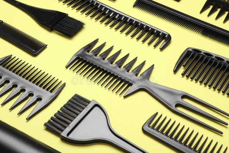 Composition with Modern Hair Combs on Yellow Background Stock Photo ...