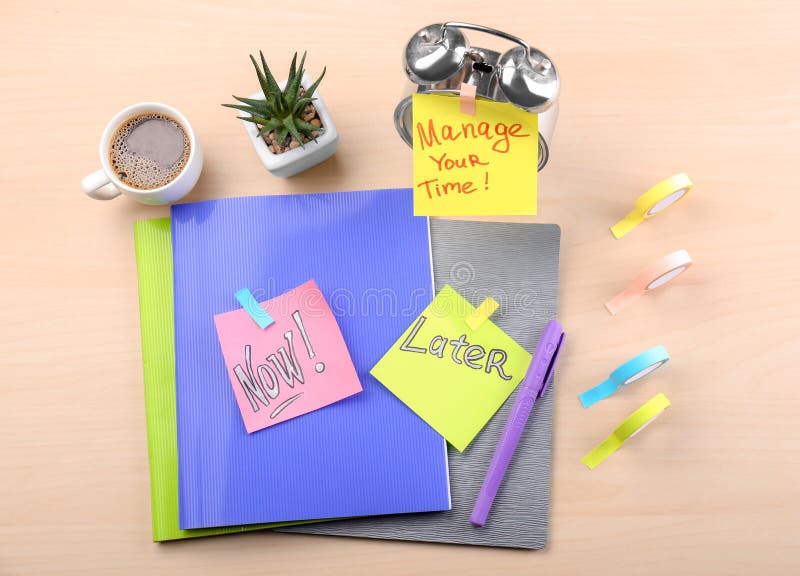 Composition with Notebooks, Alarm Clock and Sticky Notes on Wooden ...