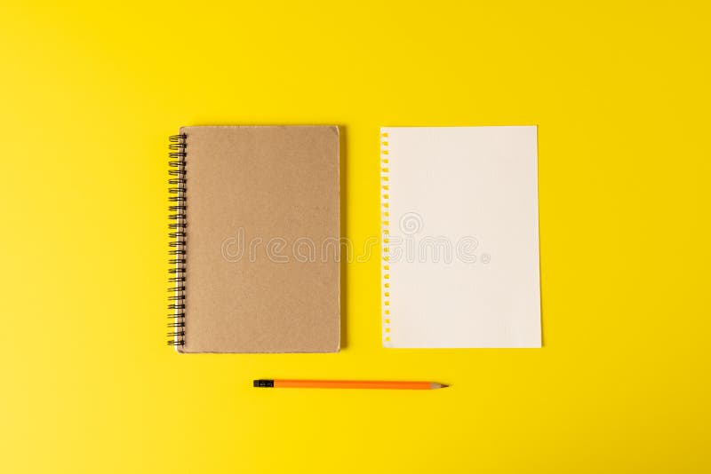 Composition of Notebooks with Copy Space and Pencil on Yellow Surface ...