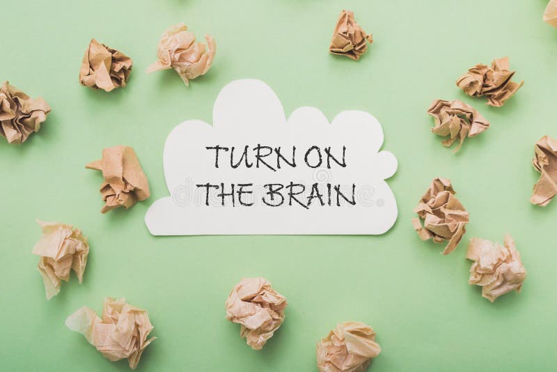 Composition with Phrase Turn on Brain on Green Background Stock Photo ...