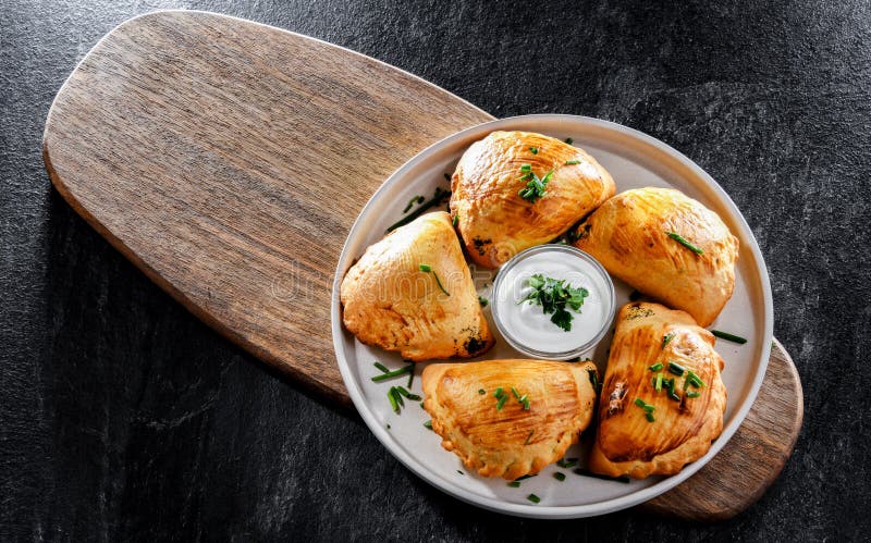 Composition with a Plate of Oven-baked Pierogi Stock Photo - Image of ...