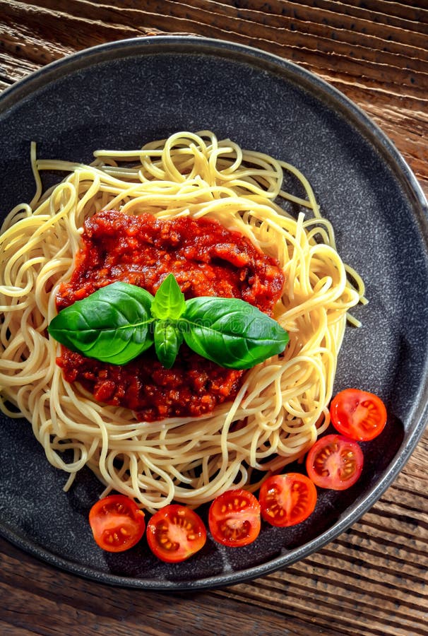 Composition with a Plate of Spaghetti Bolognese Stock Photo - Image of ...