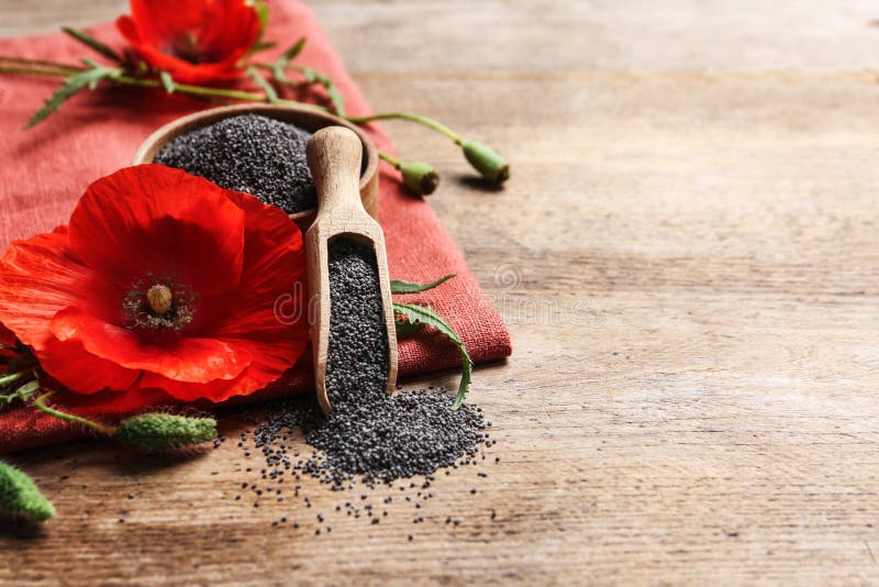 Composition with Poppy Seeds and Flower on Wooden Table Stock Image ...