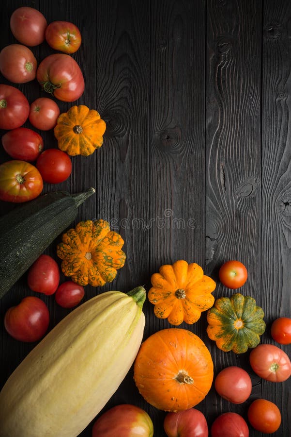 Composition of Pumpkin Squash and Tomato on a Wooden Background Stock ...