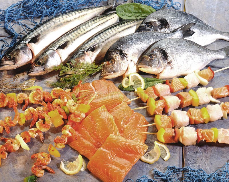 Composition with Raw Fish and Fish Brochettes Stock Photo - Image of ...