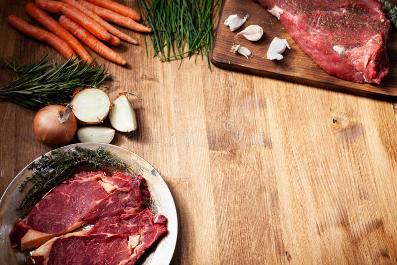 Composition with Raw Meat and Different Vegetables on Wooden Table ...