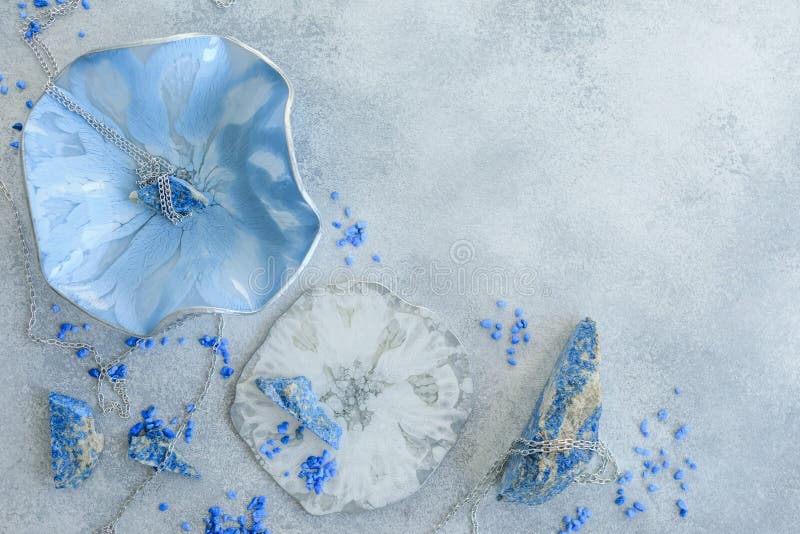 Composition with Resin Art Plate and Blue Stones on Gray Background ...