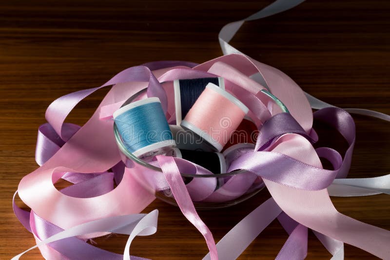 Composition of Ribbons and Thread on a Wooden Table. Stock Photo ...
