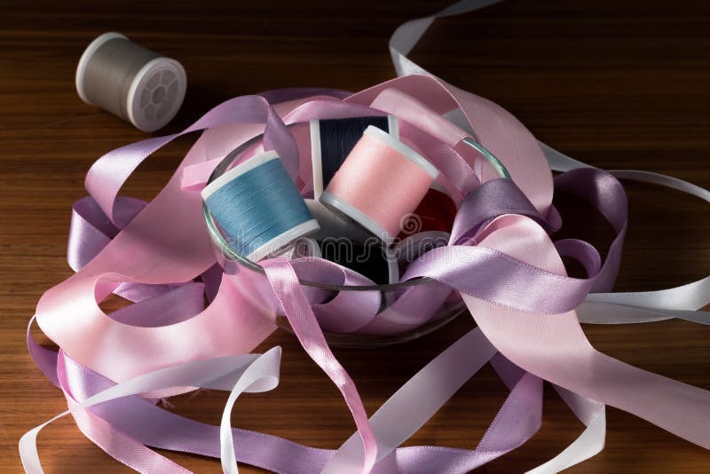 Composition of Ribbons and Thread on a Wooden Table. Stock Image ...
