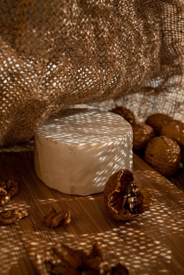 Composition of a Round Head of Cheese with White Mold and Walnuts on a ...