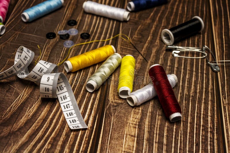 A Composition of Sewing Material with Many Spools of Colored Thread ...