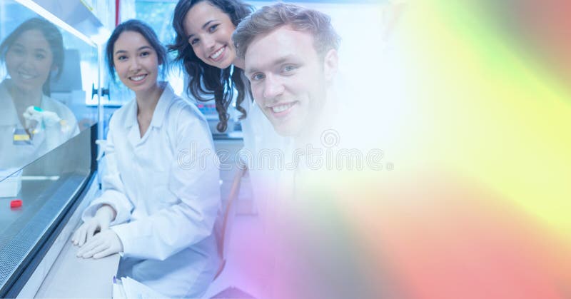 Composition of Smiling Lab Technicians Using at Work, with Blurred ...