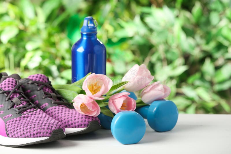 Composition with Spring Flowers and Sports Items on Green Background ...