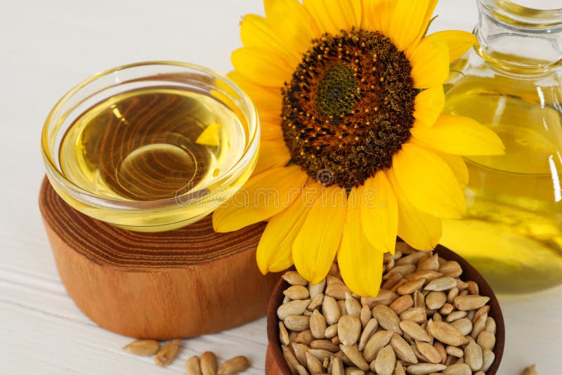 Composition with Sunflower Oil on White Table, Closeup Stock Photo ...