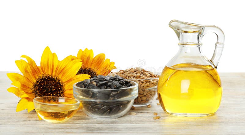 Composition with Sunflower Oil on Wooden Table Against White Background ...