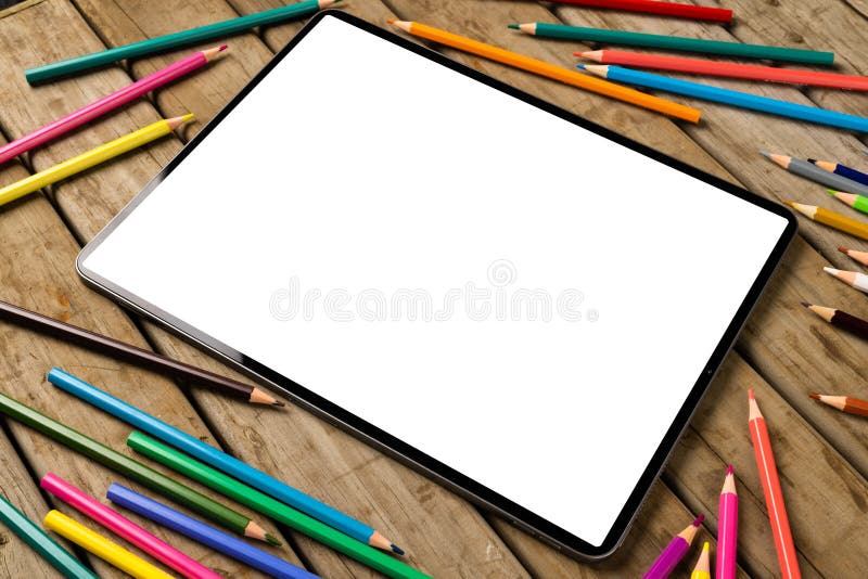 Composition of Tablet with Copy Space and Crayons on Wooden Surface ...