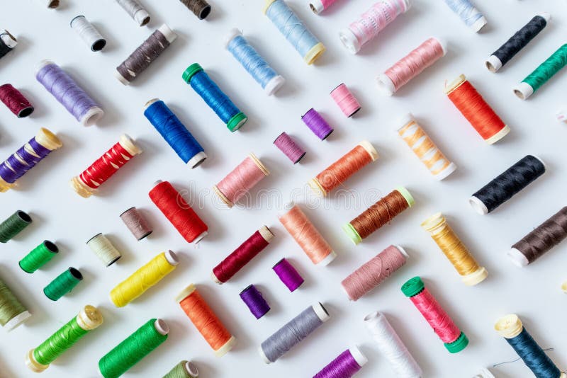 A Composition of Sewing Material with Many Spools of Colored Thread ...