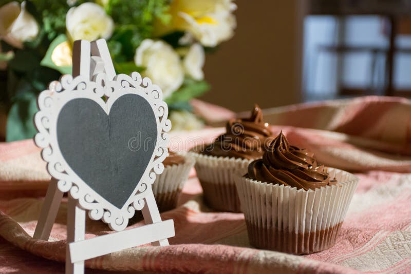 Composition of Three Chocolate Cup Cakes and a Heart-Shaped Blackboard ...