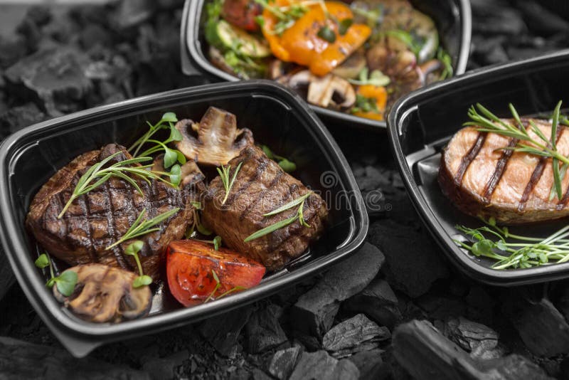 Composition of Three Grilled Dishes in To Go Boxes Stock Photo - Image ...