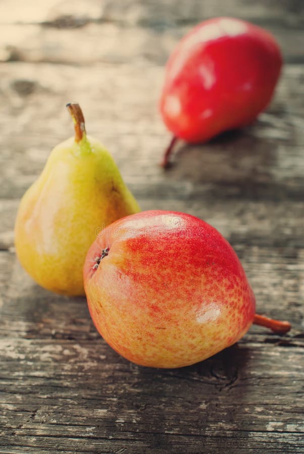 Composition with Three Red Pears on the Wooden Table Stock Image ...
