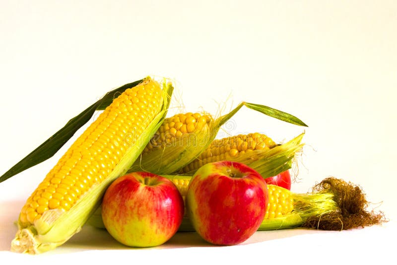 Unpeeled Corn Cobs and Red Apples Isolated on White Background. Stock ...