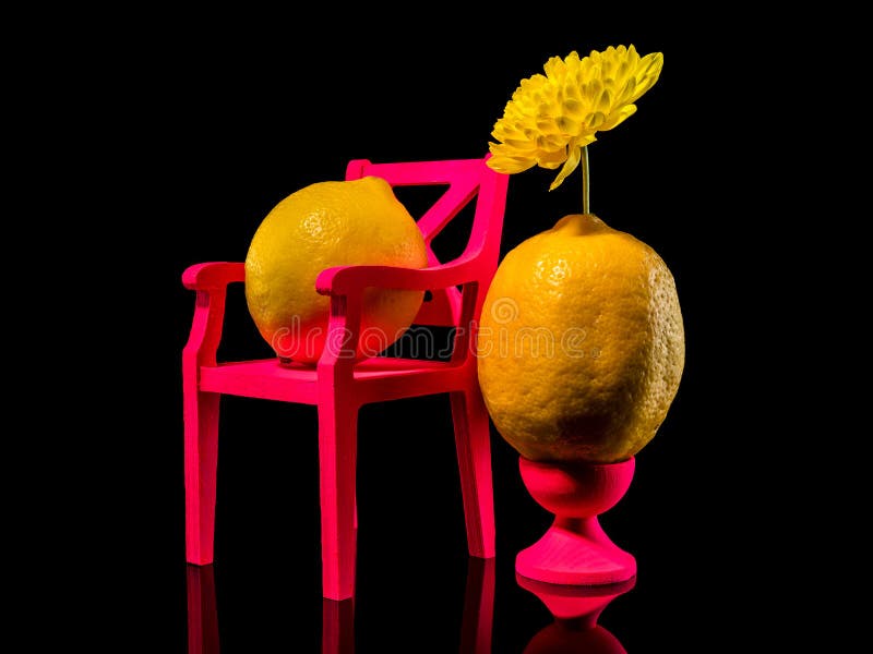 Composition with Two Lemons and Chair on a Black Background Stock Photo ...