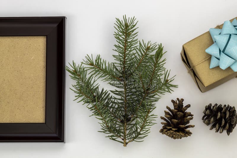 Composition Using Pine Branch, Empty Picture Frame, Gift Box, and Two ...