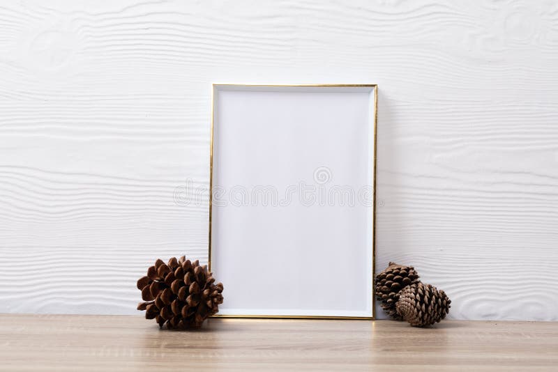 Composition of White Card in Frame with Copy Space and Pine Cones on ...