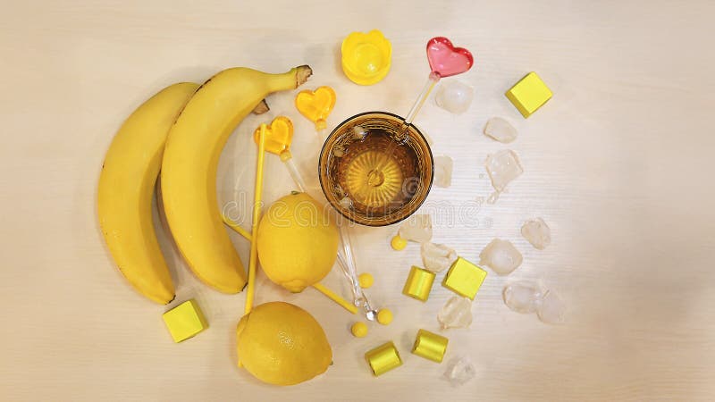 Composition of Yellow Objects, Lemons, Bananas, Chocolate, Ice Cubes ...