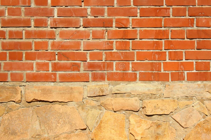 Compound of Bricks and Rocks in Facade. Red Brick Wall Over Rock ...