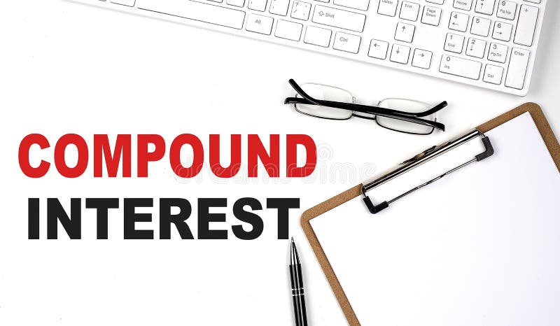COMPOUND INTEREST Text Written on the White Background with Keyboard ...