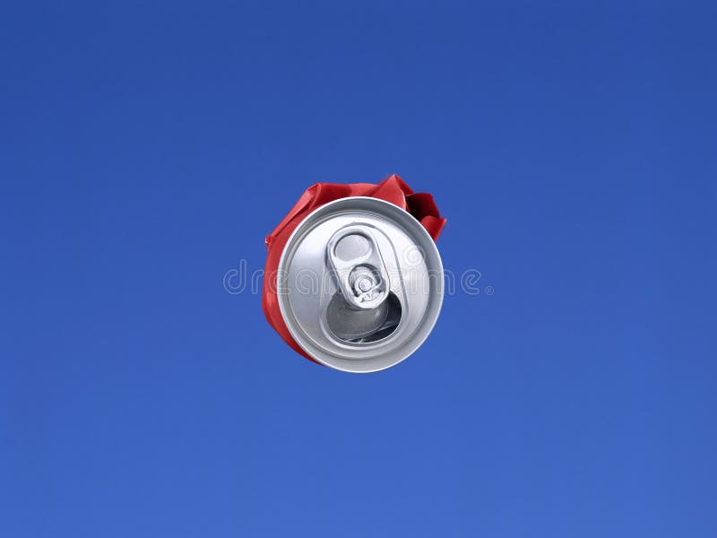 Compressed Cans Shot in the Air with Blue Sky Background Stock Image ...